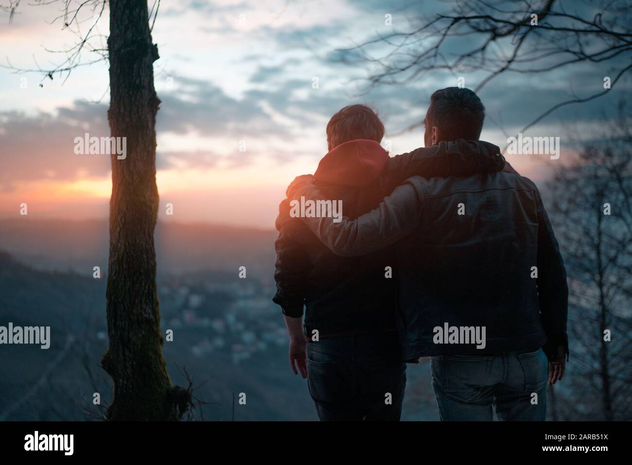 Two men watching sunrise hi-res stock photography and images - Alamy