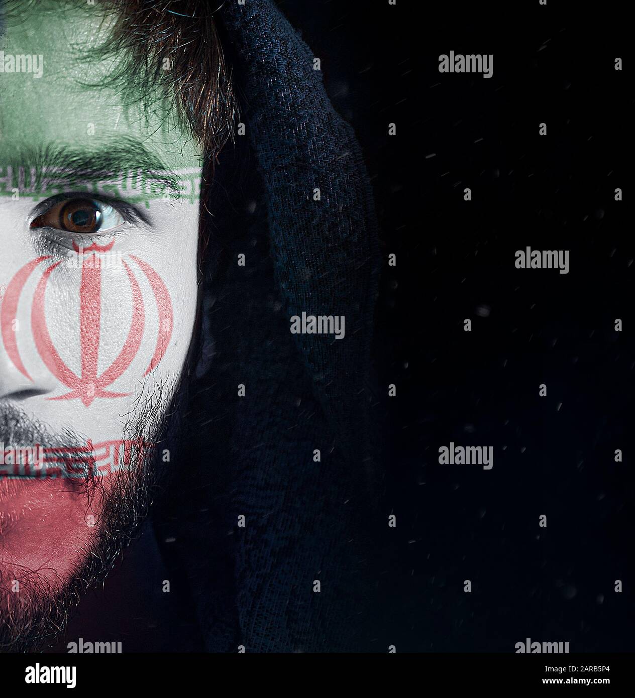 Young man with his face painted in the colors of Iran's flag Stock ...
