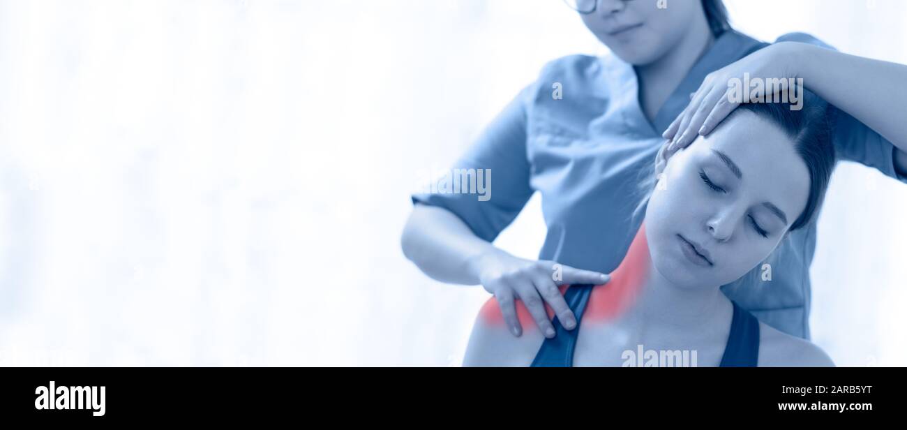 Female physiotherapist or a chiropractor adjusting patients neck ...