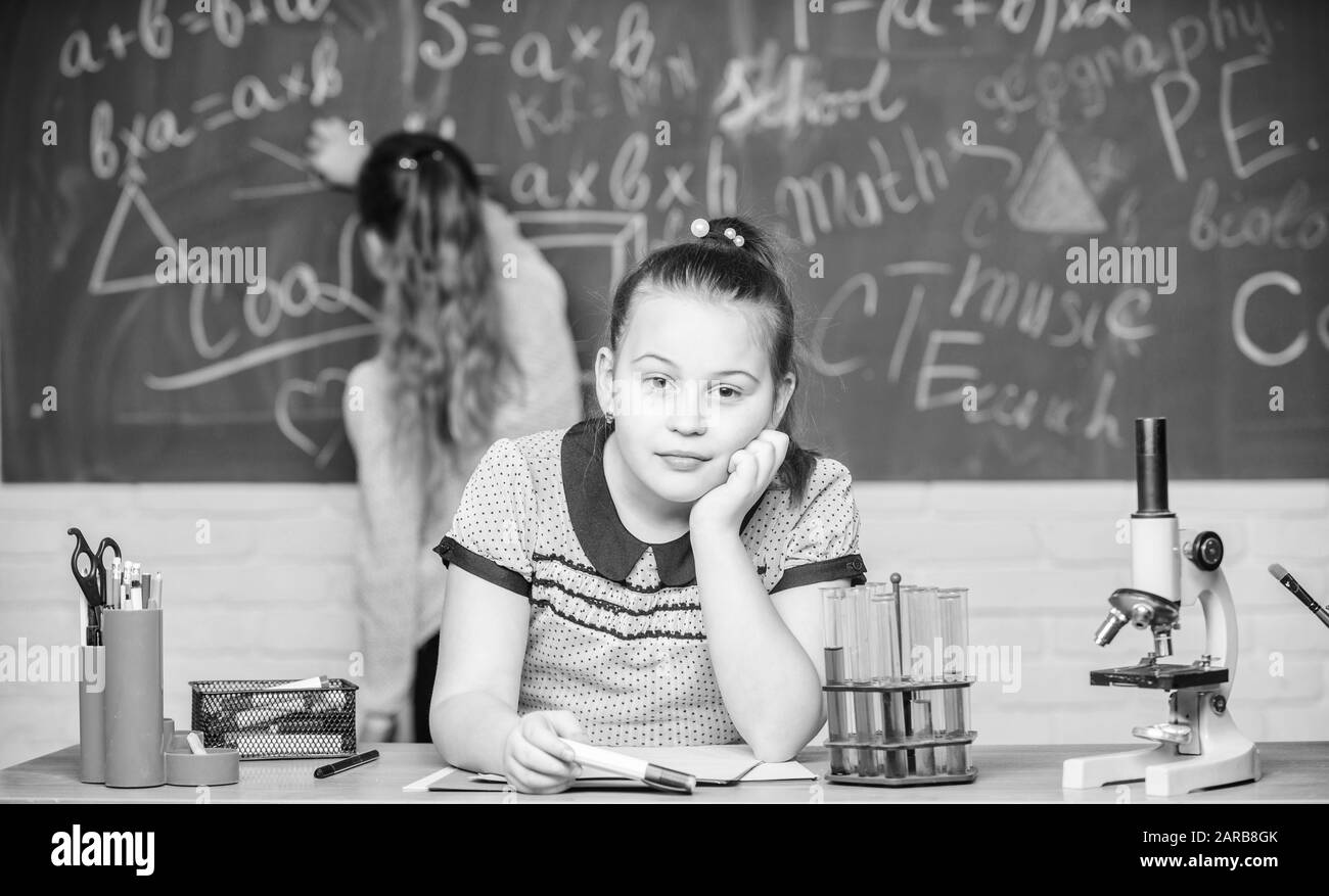 Bright minds at work. Little scientist work with microscope. Biology ...