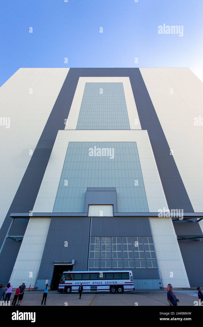 looking up on NASA's iconic vehicle assembly building with tourbus at John F Kennedy Space ...