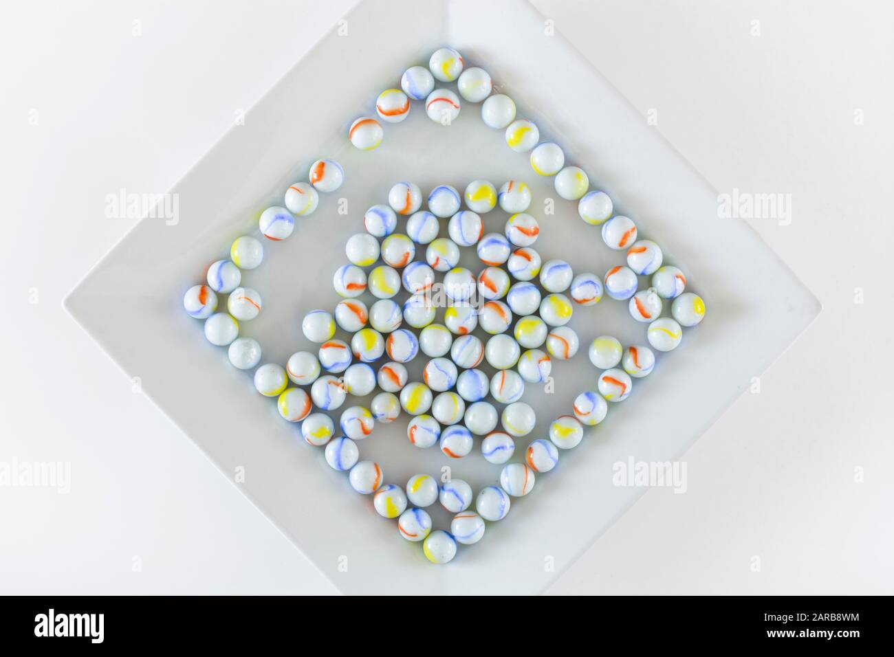 White marbles - unrelated to Elgin Marbles in pottery dish - as ...
