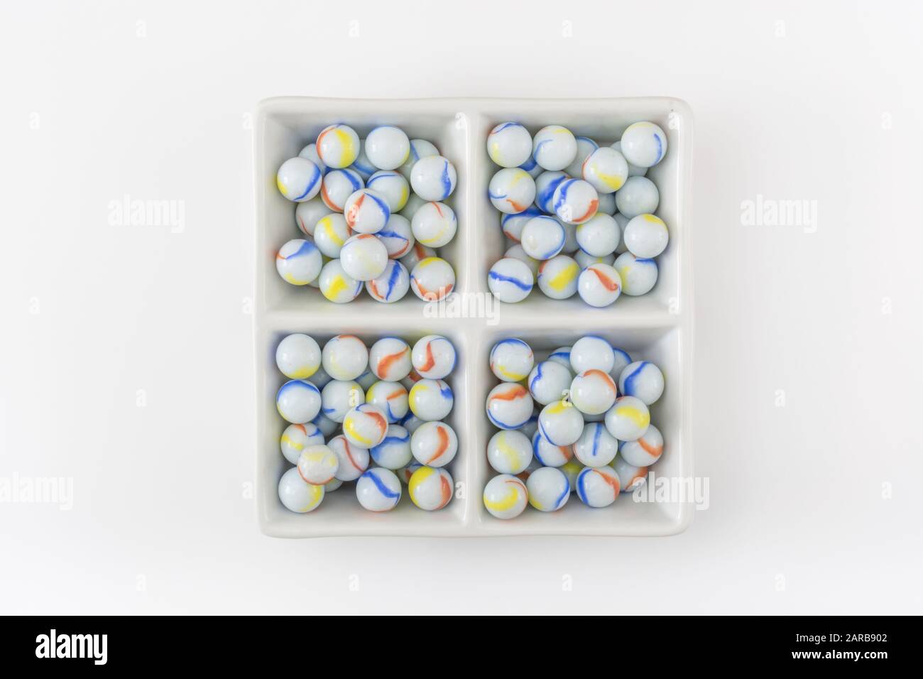 White marbles - unrelated to Elgin Marbles in pottery dish - as ...