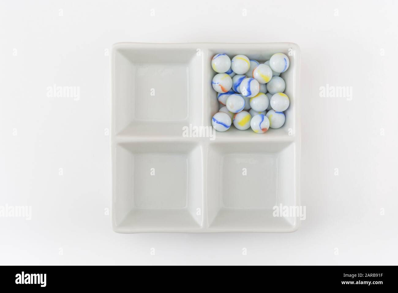 White marbles - unrelated to Elgin Marbles in pottery dish - as ...