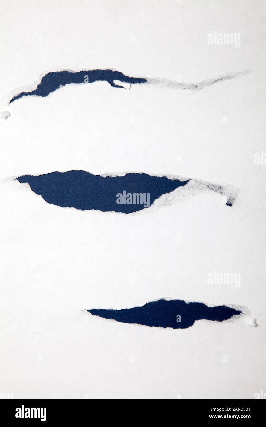 Torn Paper Sheet on Blue Stock Photo - Alamy