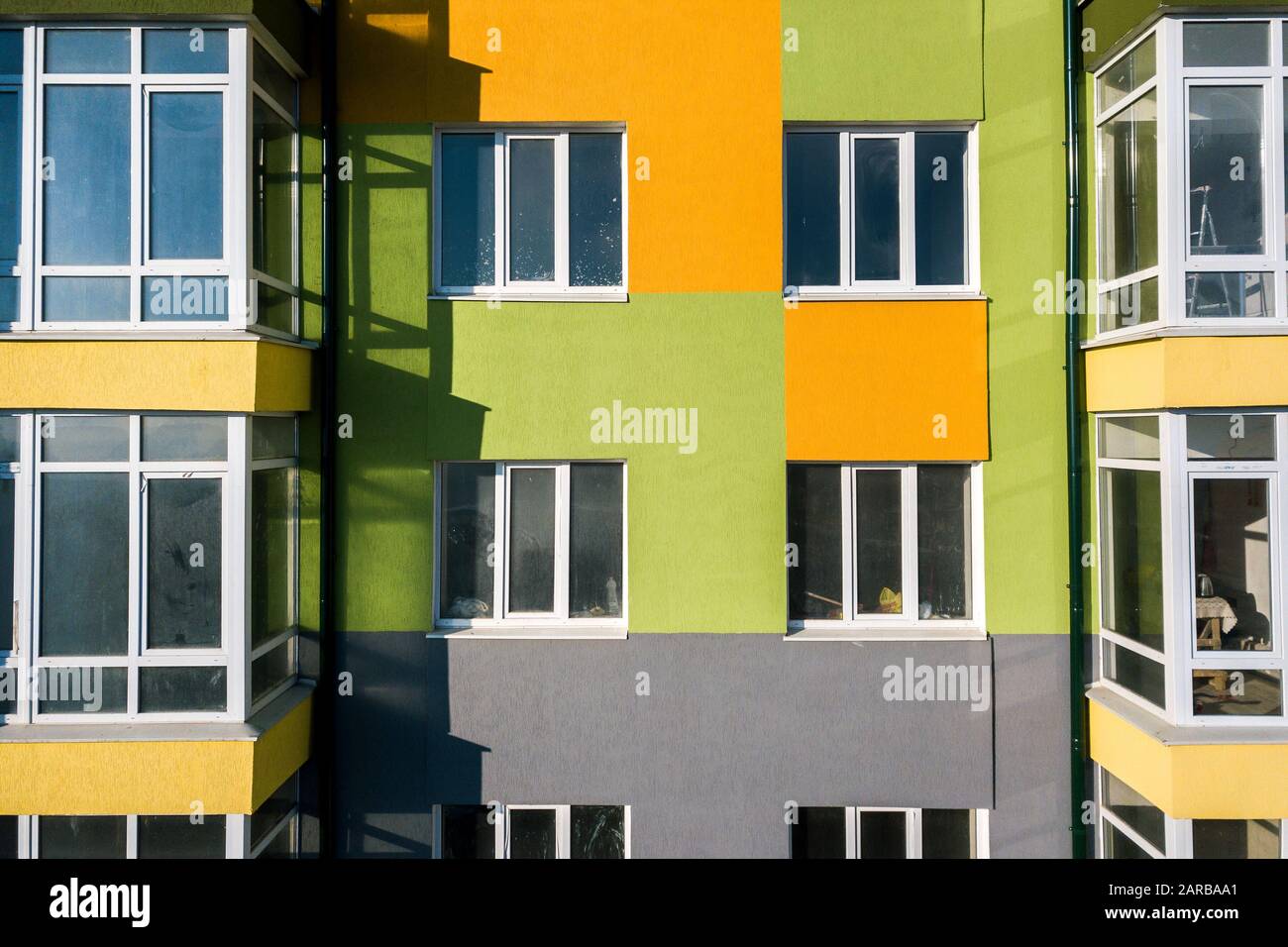 Aerial view of a tall residential apartment building with many windows ...