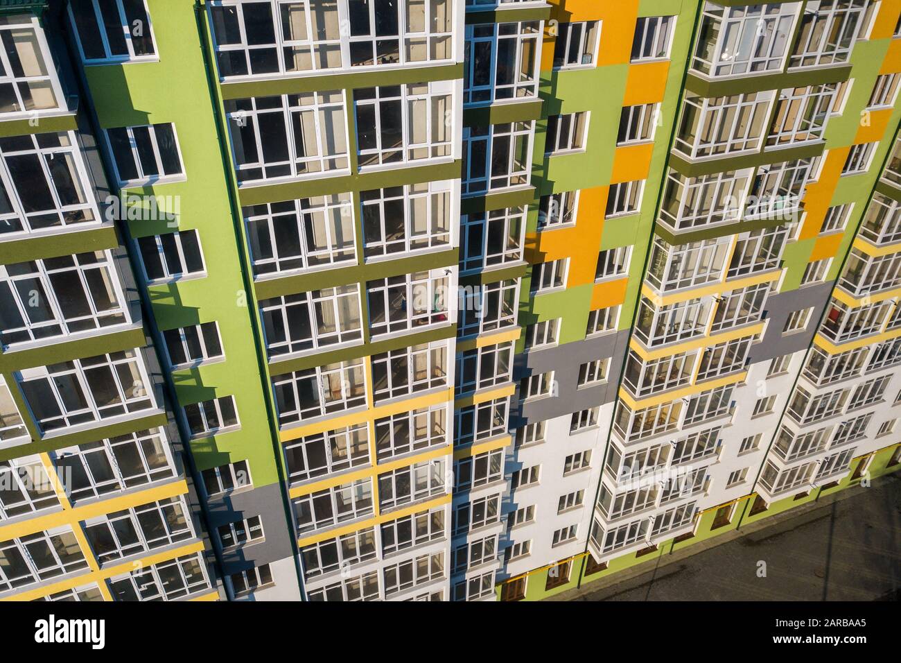 Aerial view of a tall residential apartment building with many windows ...