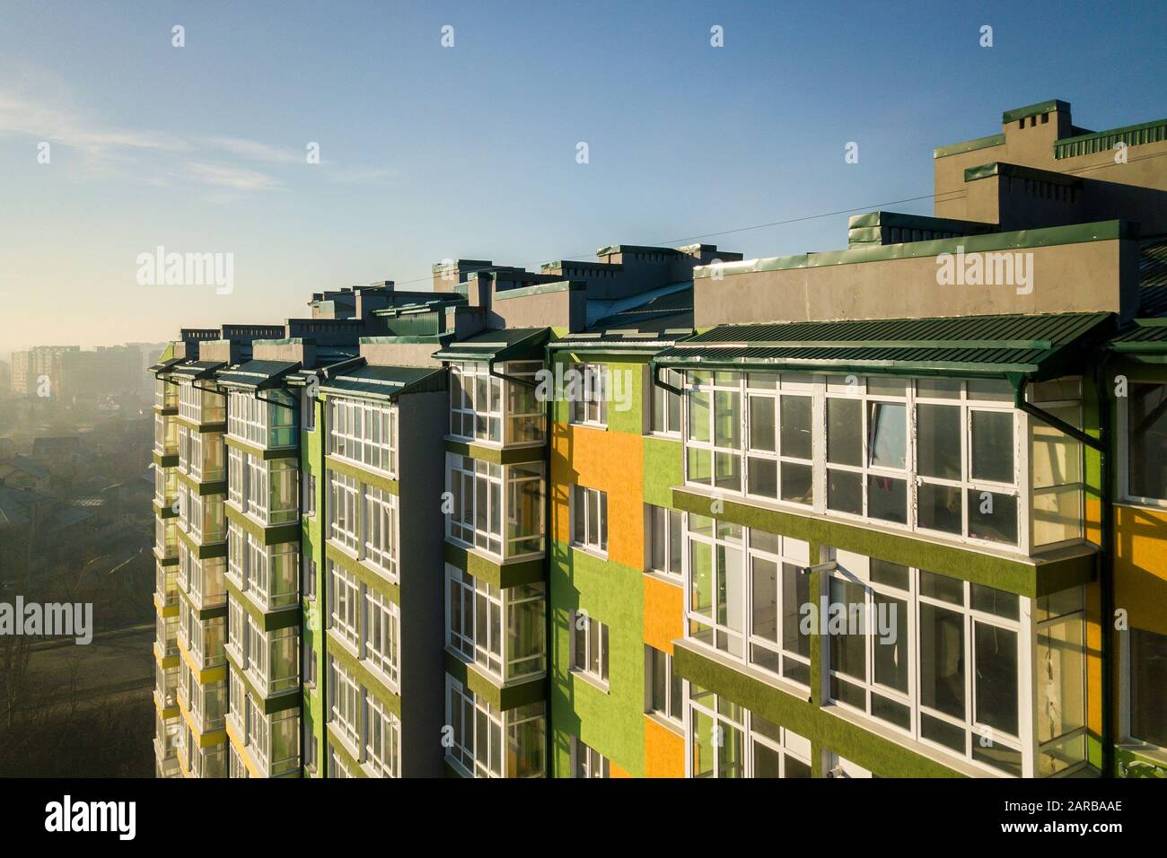 Aerial view of a tall residential apartment building with many windows ...