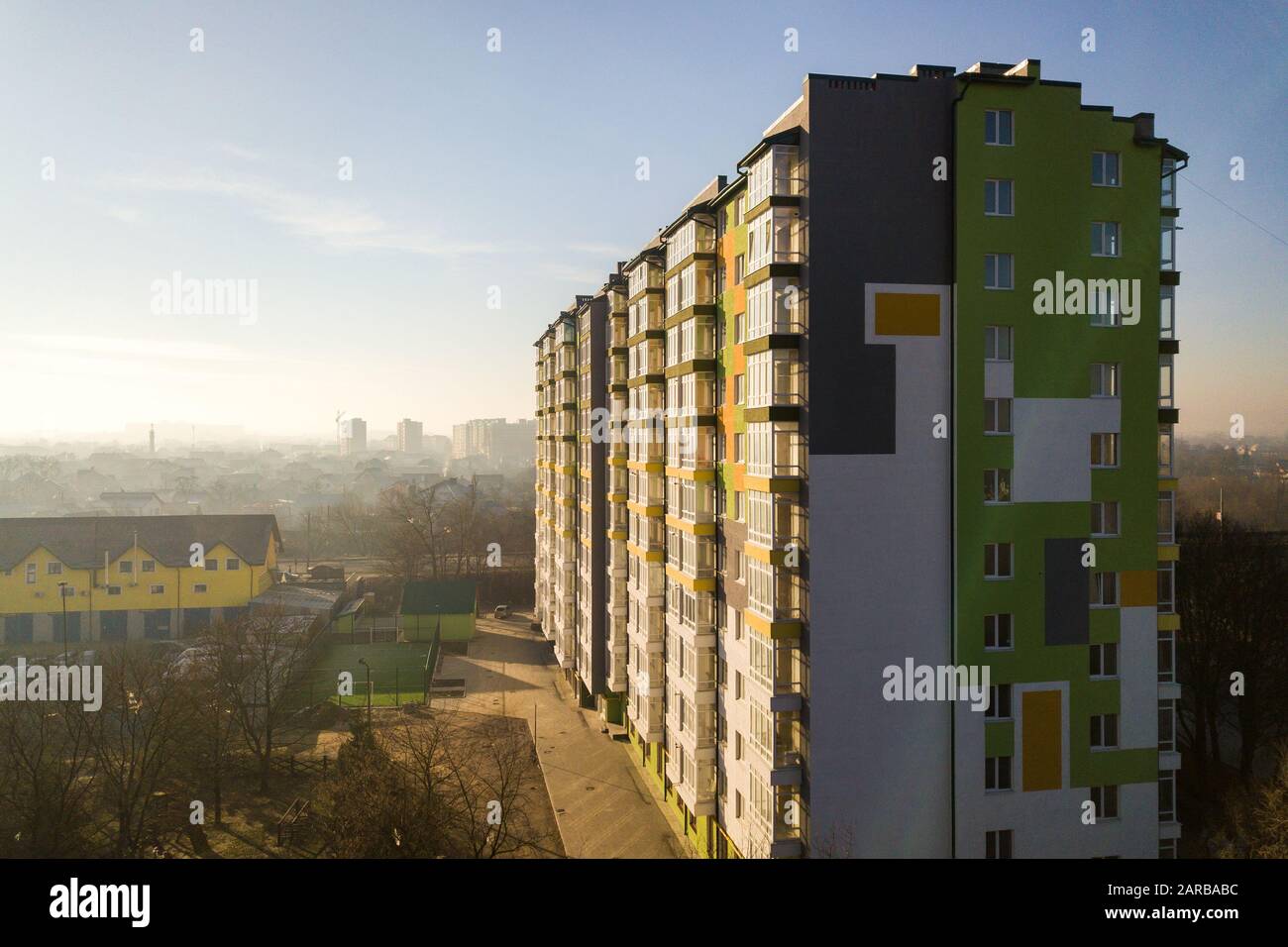 Aerial view of a tall residential apartment building with many windows ...