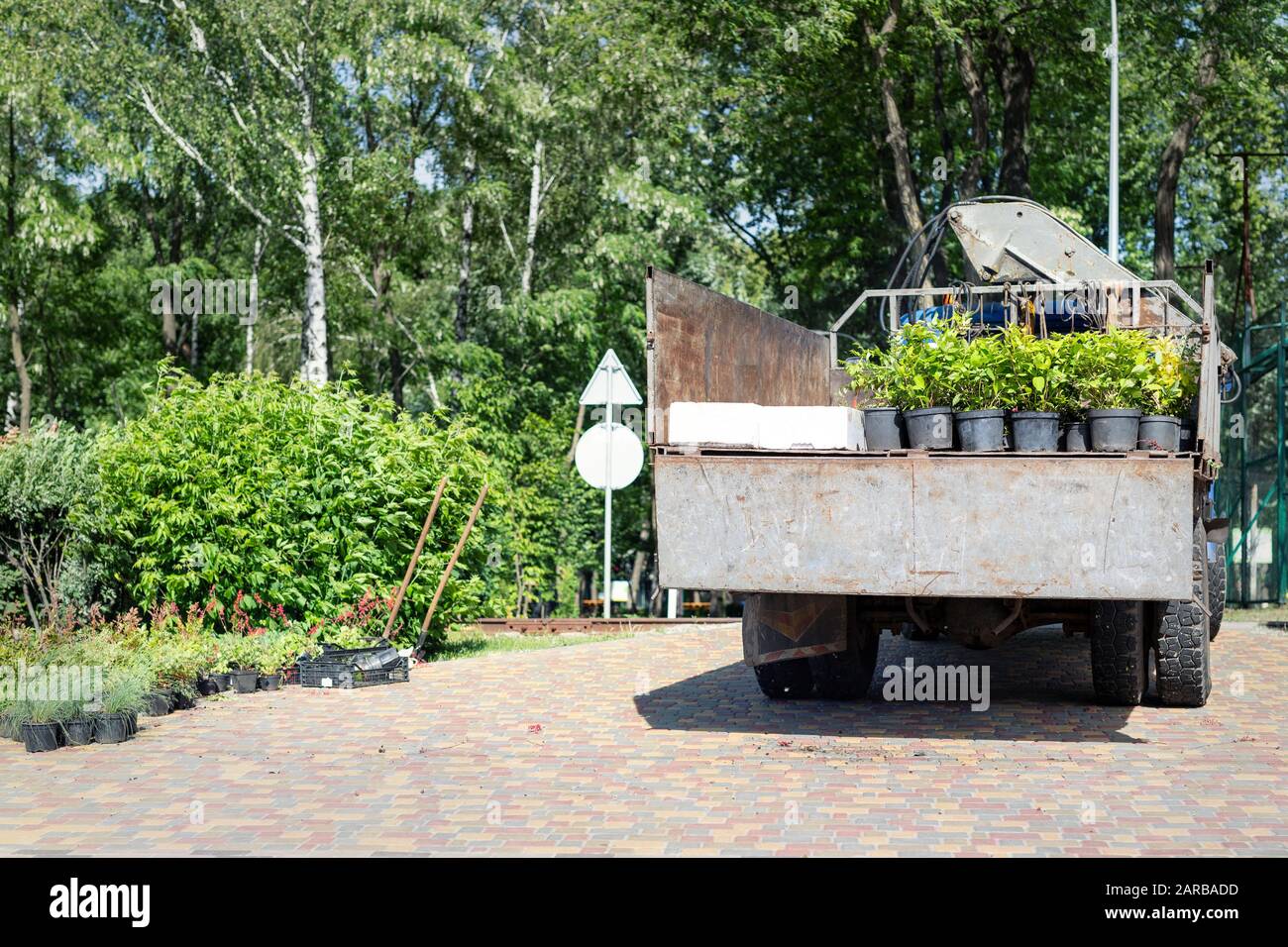 Back view of open truck body delivering from nursery plants and flowers ...