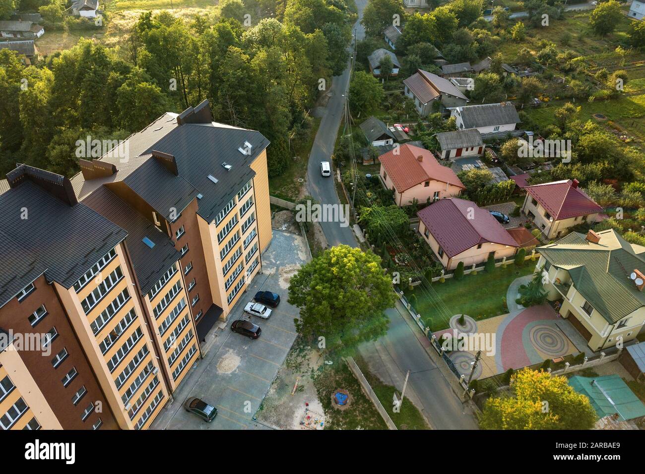 Aerial view of multistory apartment buildings in green residential area ...