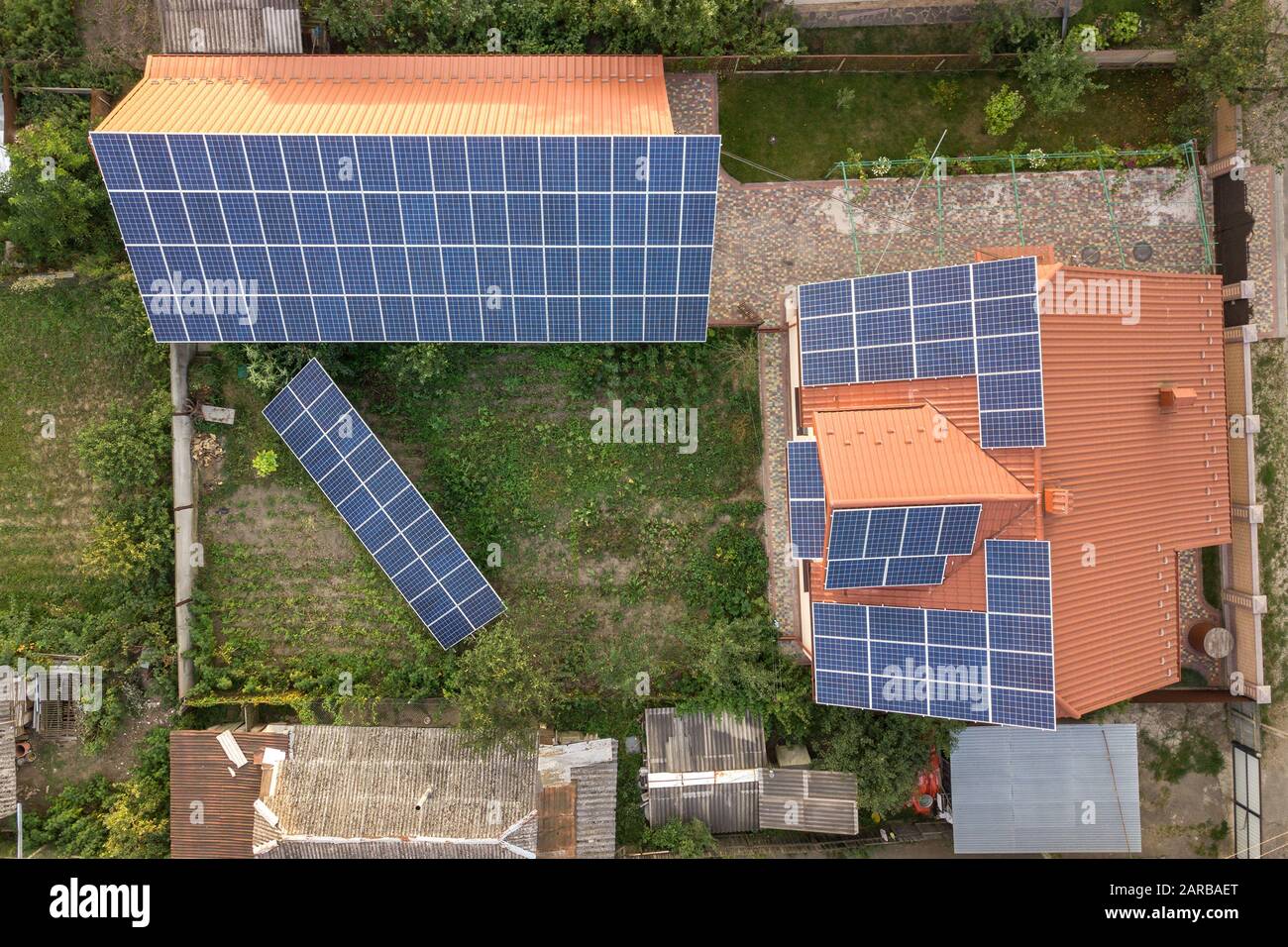 Aerial top view of new modern residential house cottage with blue shiny ...