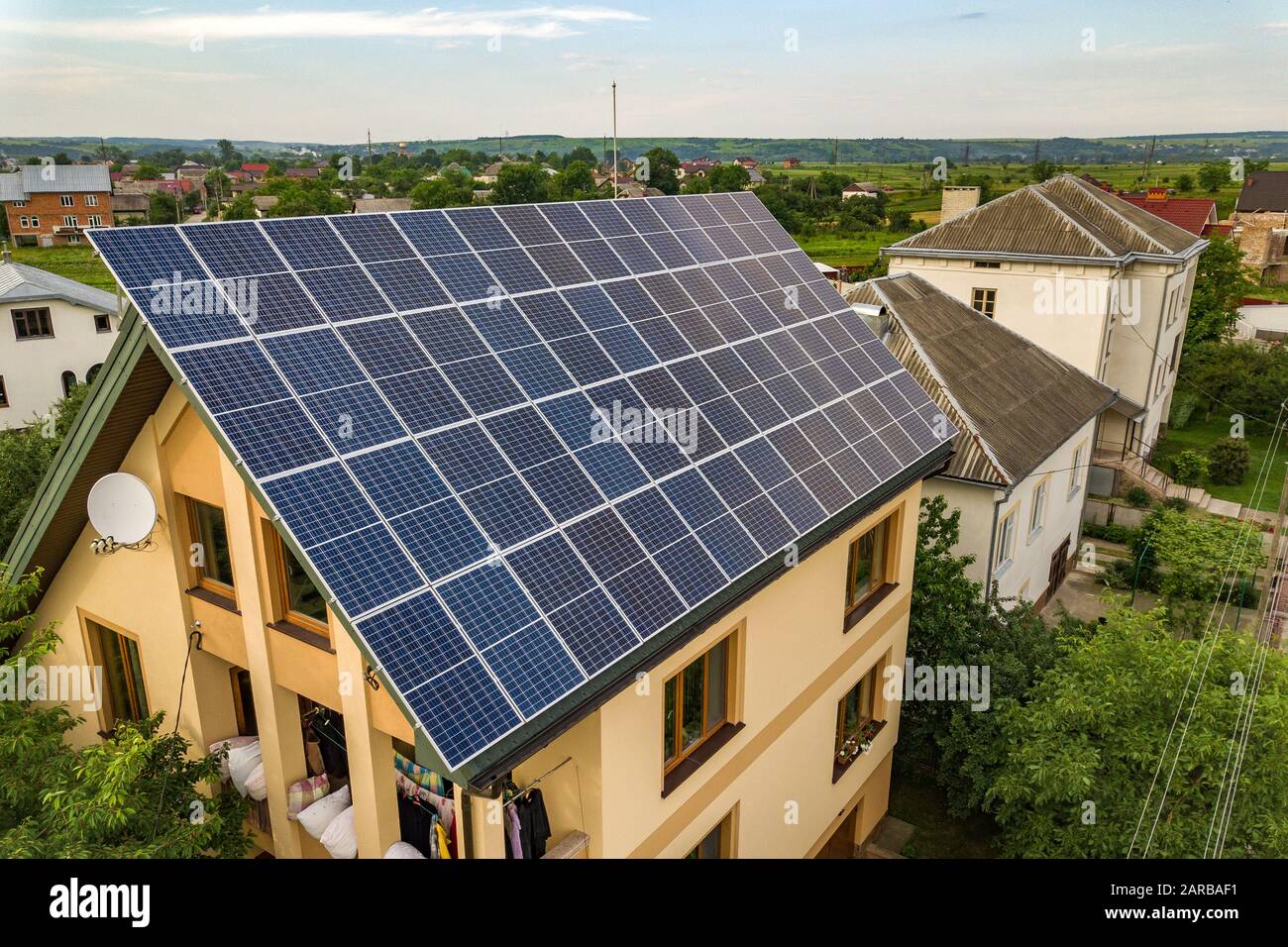 Aerial top view of new modern residential house cottage with blue shiny ...