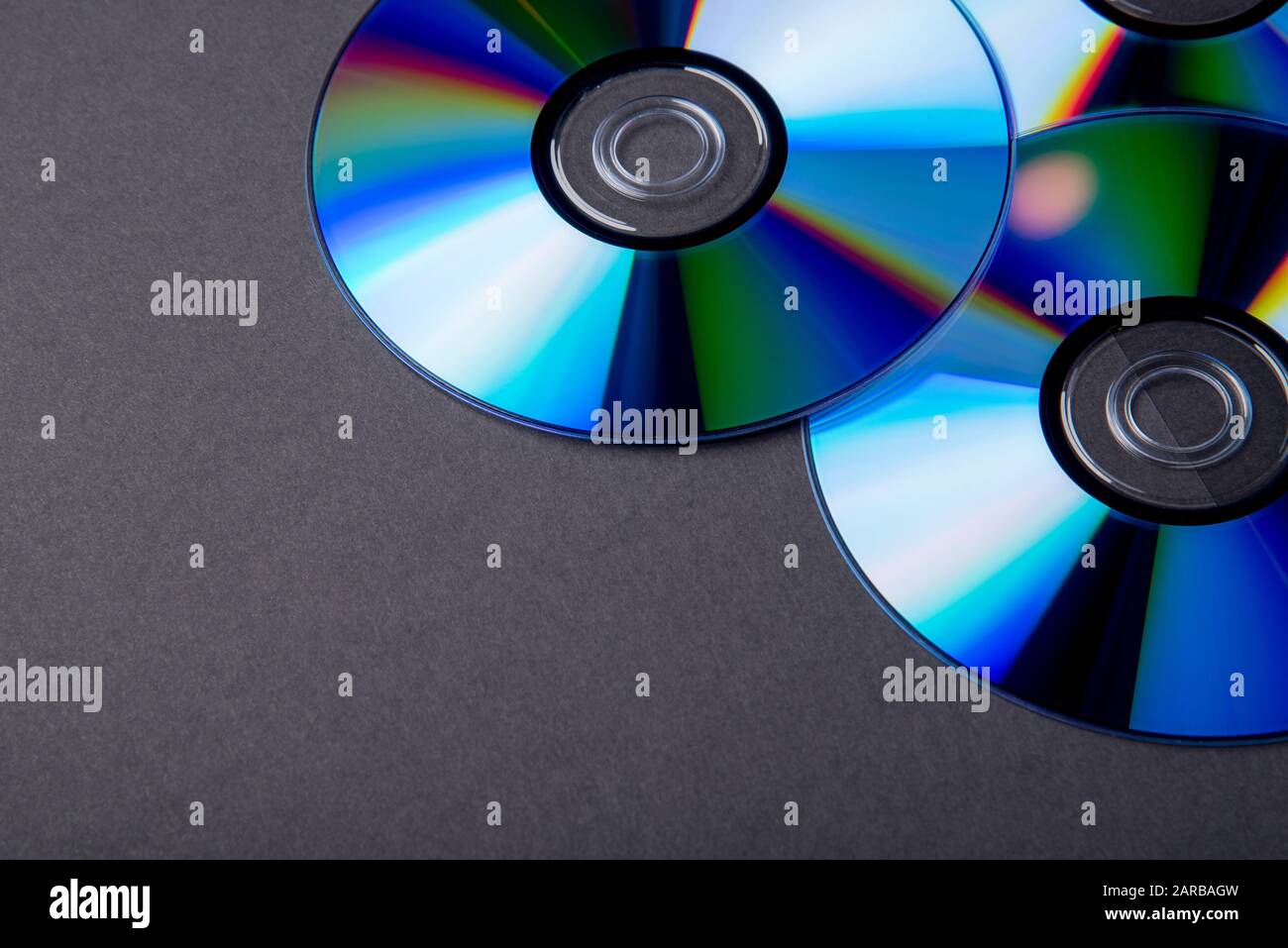 Many musical clean compact discs with a rainbow spectrum of colors as a ...