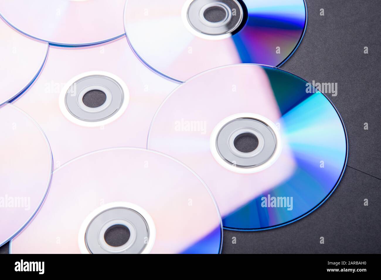 Many musical clean compact discs with a rainbow spectrum of colors as a ...