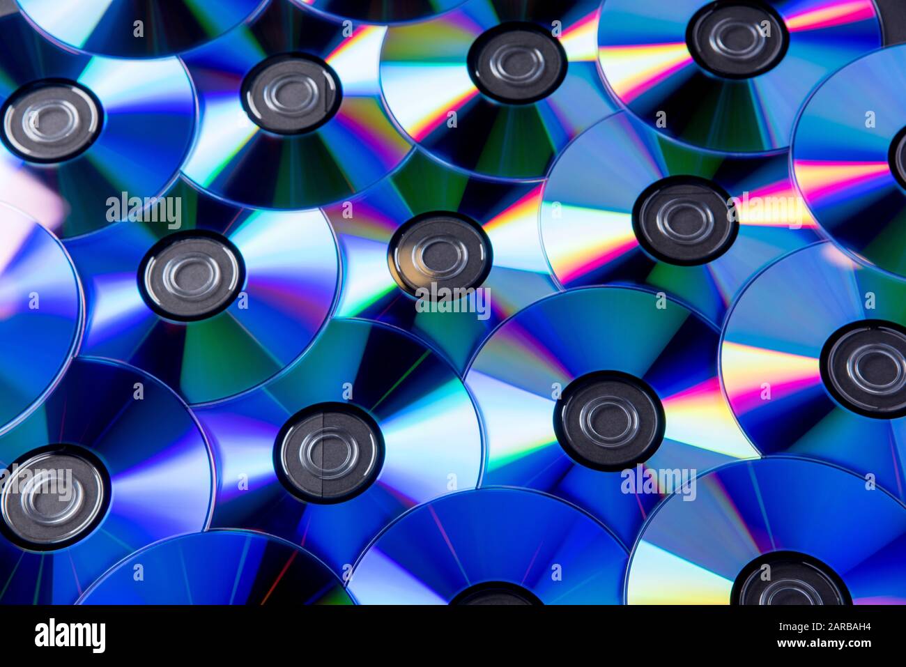 Many musical clean compact discs with a rainbow spectrum of colors as a ...