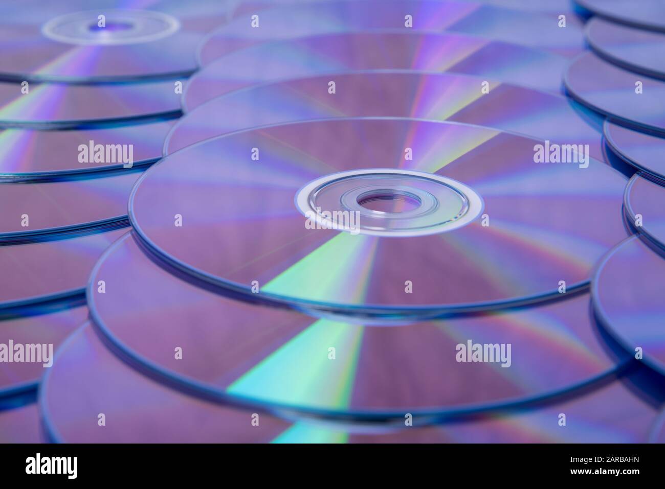 Many musical clean compact discs with a rainbow spectrum of colors as a ...