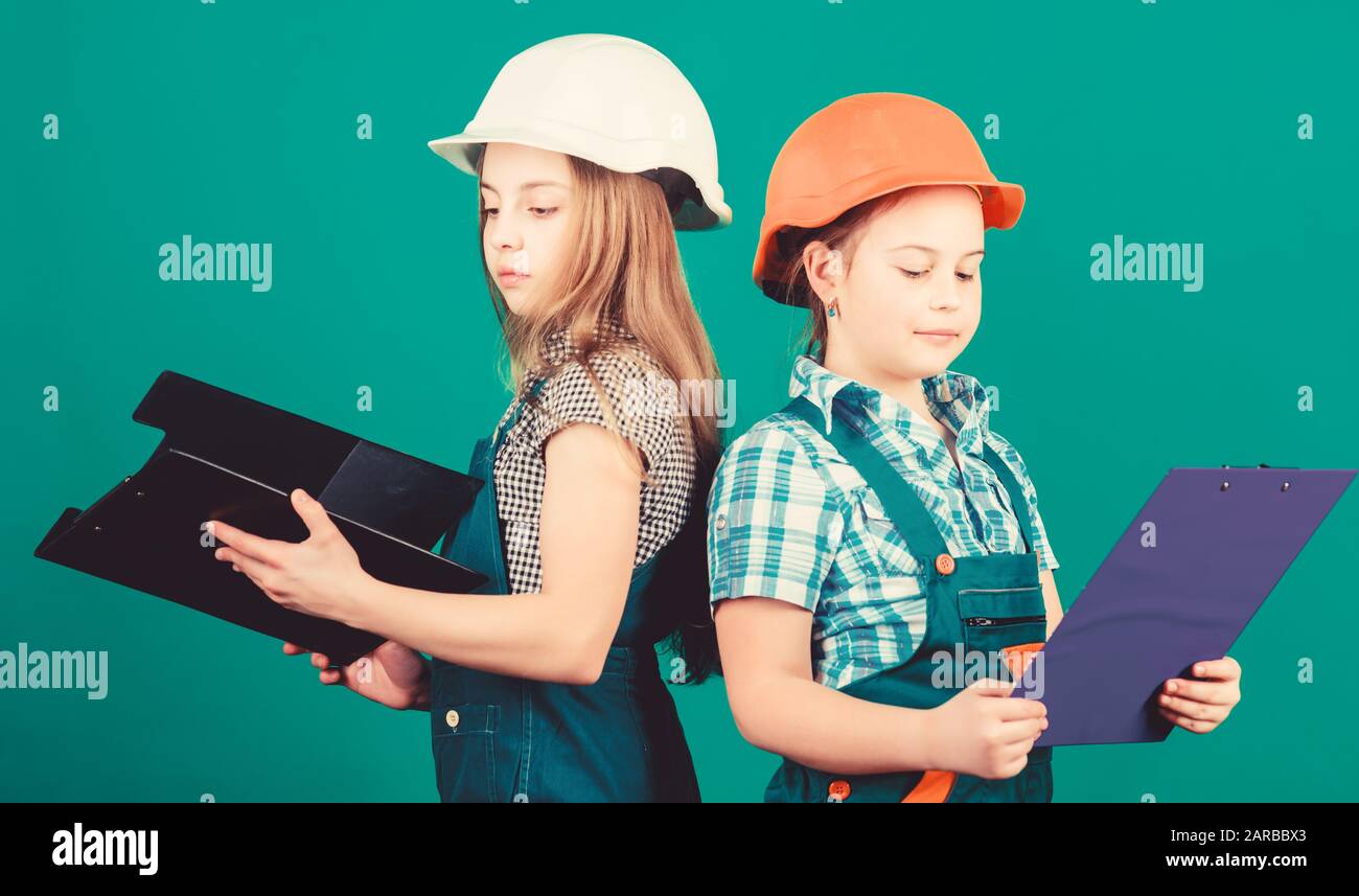 Checking every detail for defects. small girls repairing together in ...