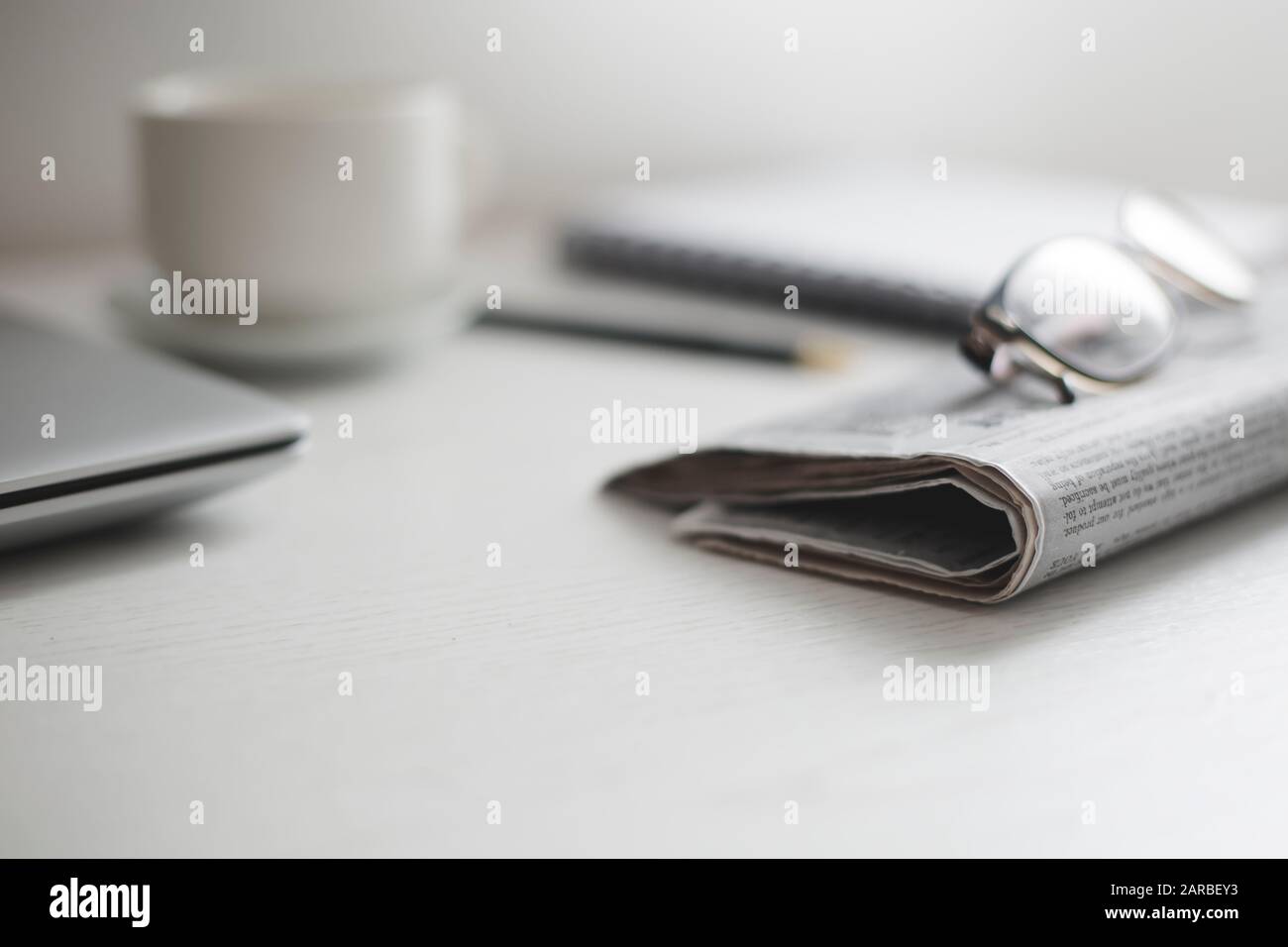Newspaper with morning news on the desktop Stock Photo - Alamy