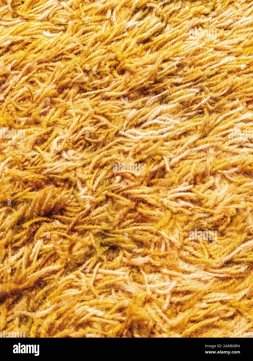 Close up full frame background texture of long carpet shag or pile in a ...