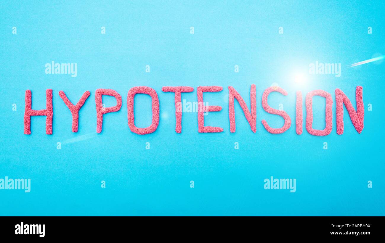 Word hypotension from red letters on a blue background. Arterial ...