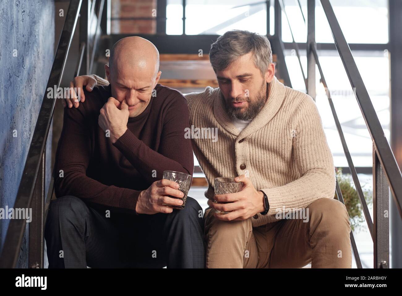 Supporting friend in difficult situation Stock Photo - Alamy