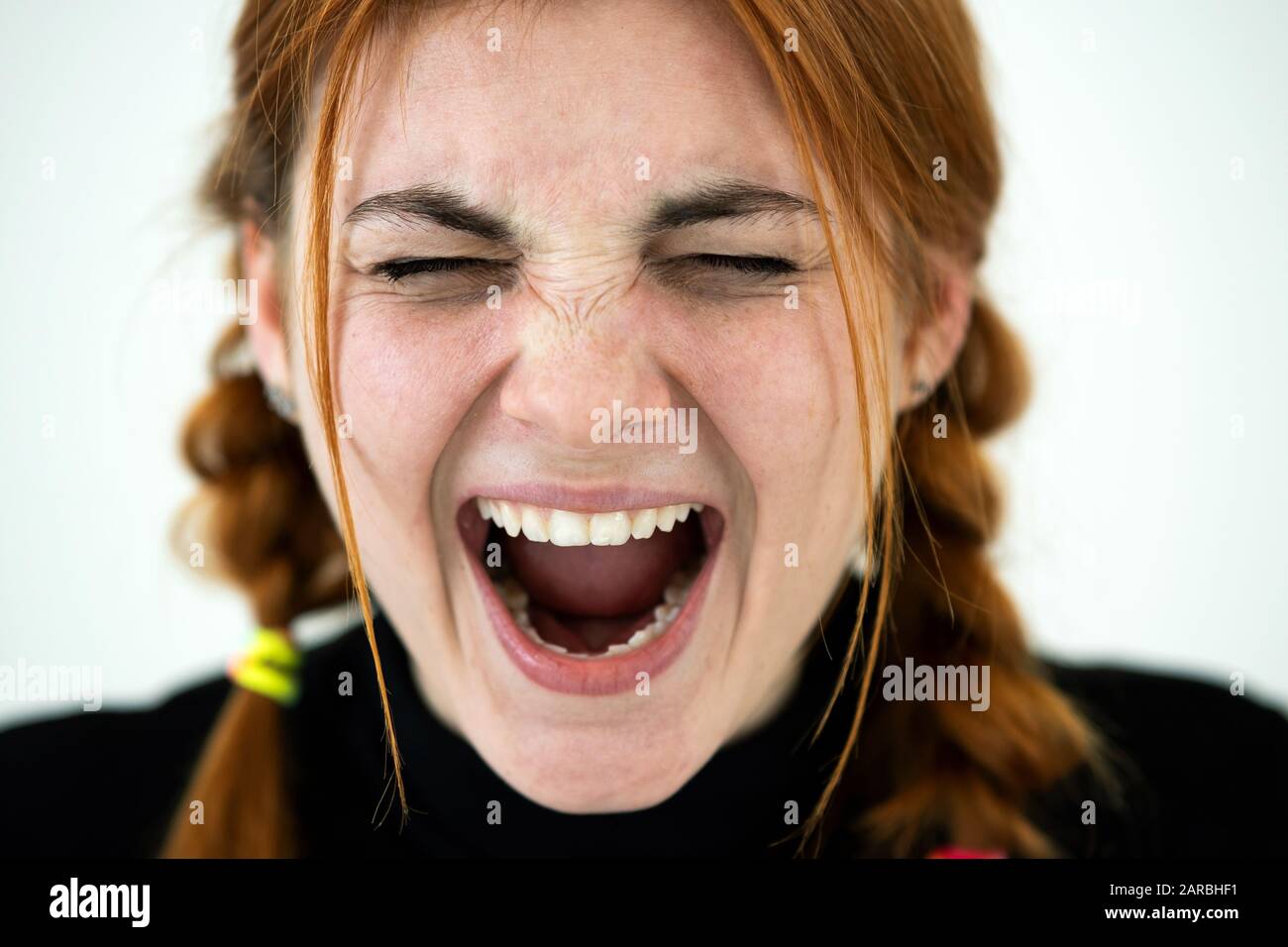 Close up portrait of angry redhead teenage girl Stock Photo - Alamy
