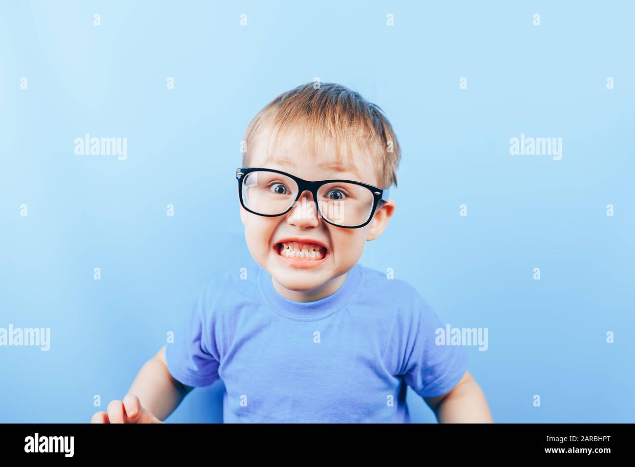 Child angry in glasses hi-res stock photography and images - Alamy