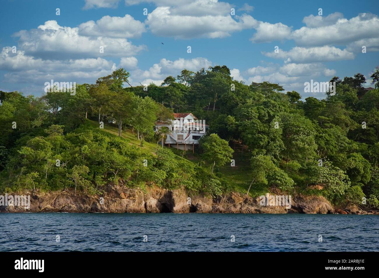 Large White House on Tropical Hillside Stock Photo - Alamy