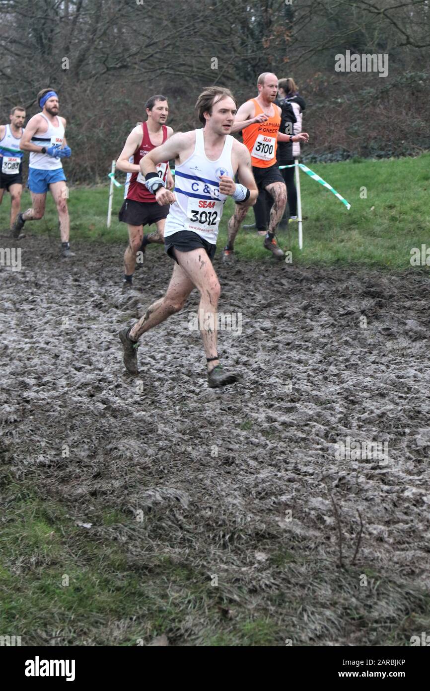 cross country runners on a muddy track Stock Photo - Alamy