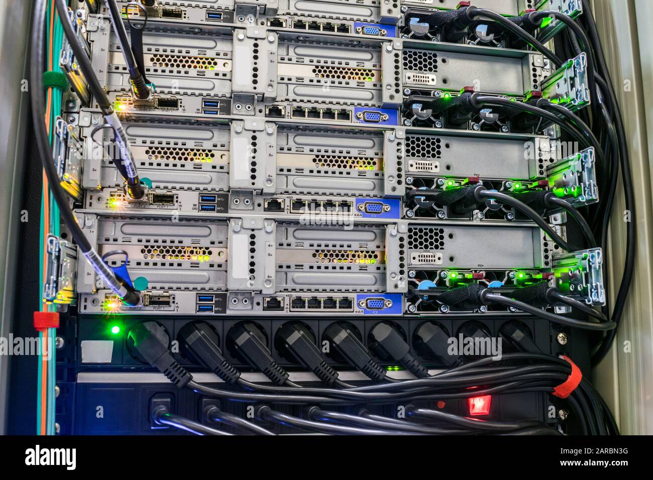 Back of the powerful computer servers installed in the rack. Electrical ...