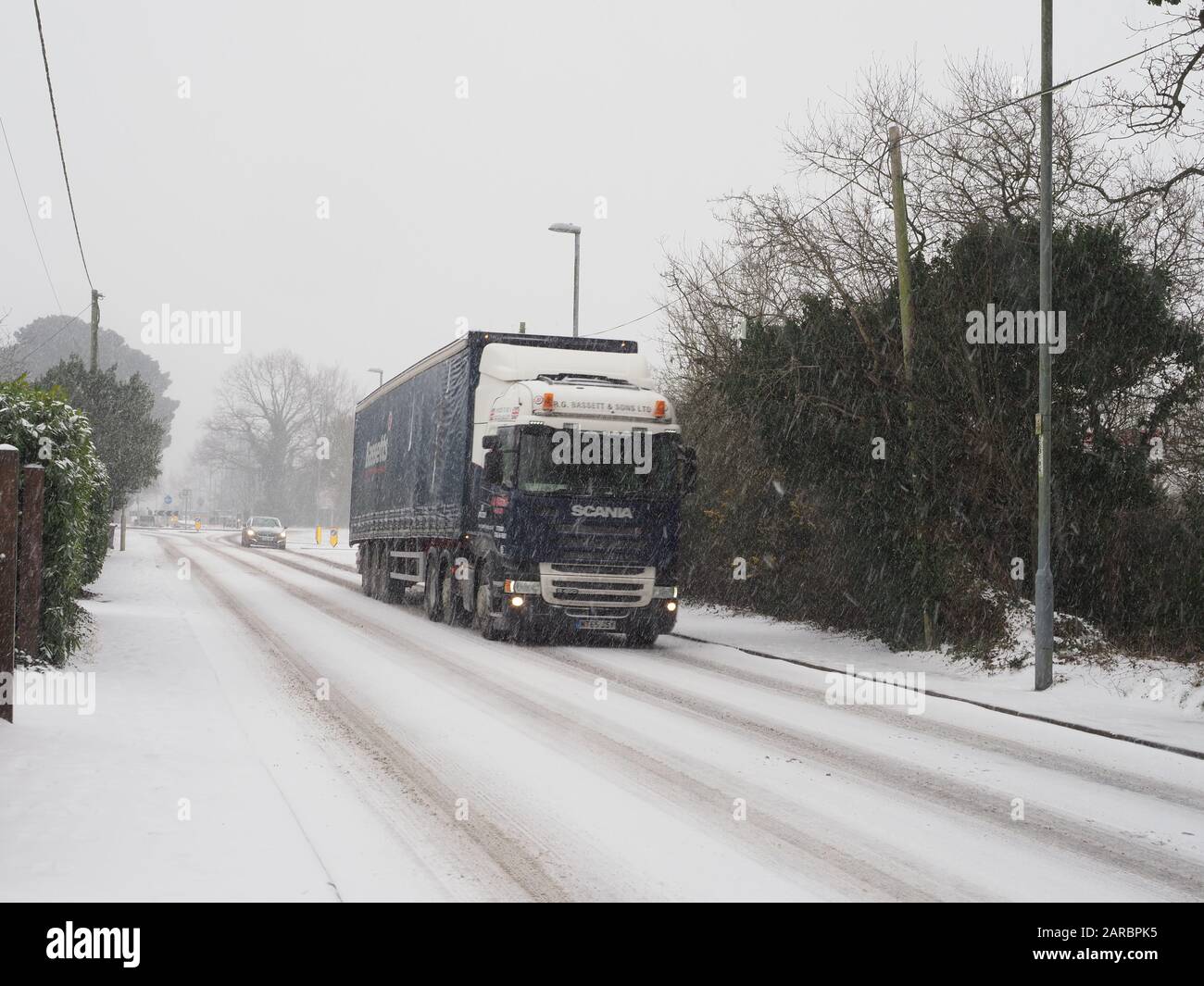 An HGV lorry on a snowy icy road in the UK Stock Photo - Alamy
