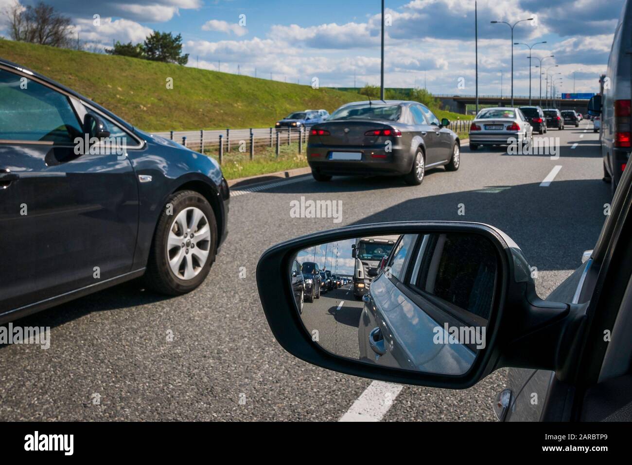 Traffic jam on motorway, front and rear view in car mirror Stock Photo ...
