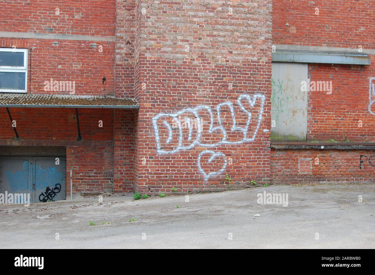 Graffiti on factory building Stock Photo - Alamy
