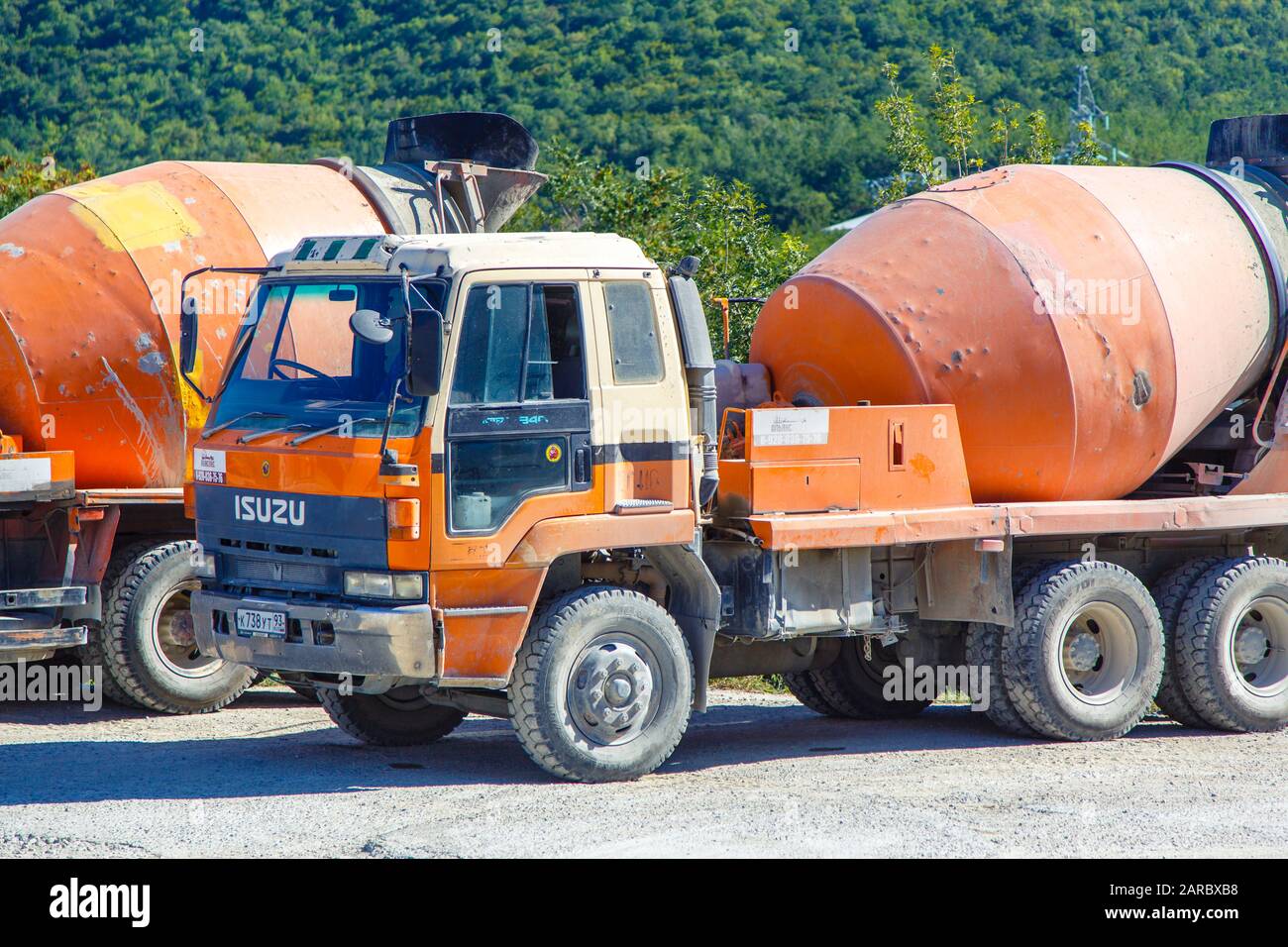 Concrete trucks on the construction site. Cars are not new, the dusty ...