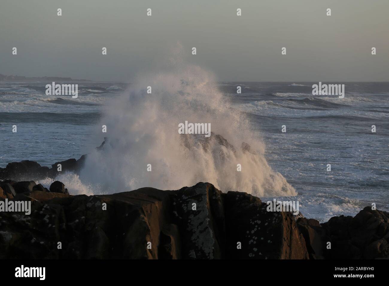 Big wave splash at dusk. Little cape of S. Paio, north of Portugal ...