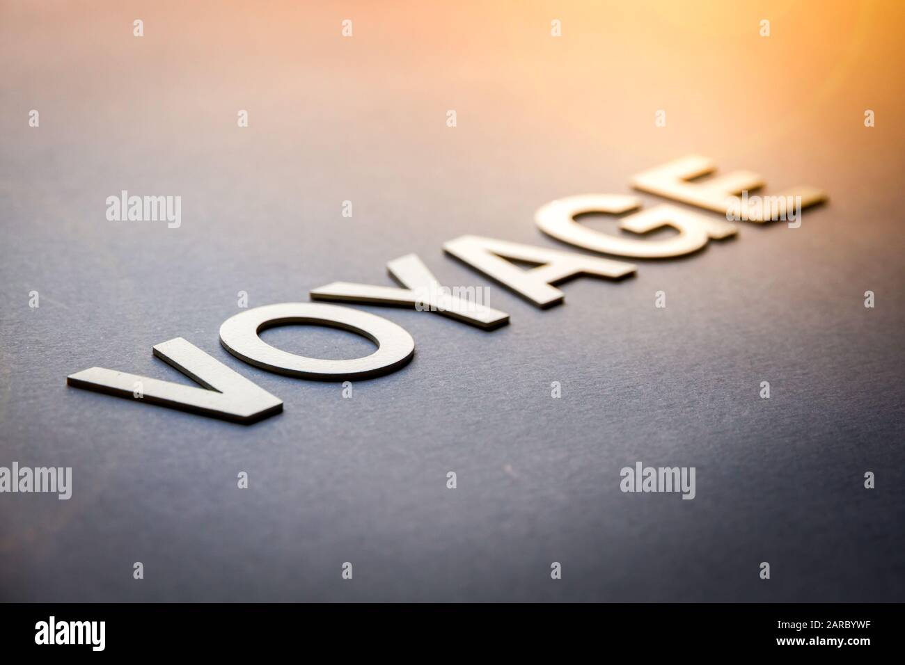 Word voyage written with white solid letters on a board Stock Photo - Alamy