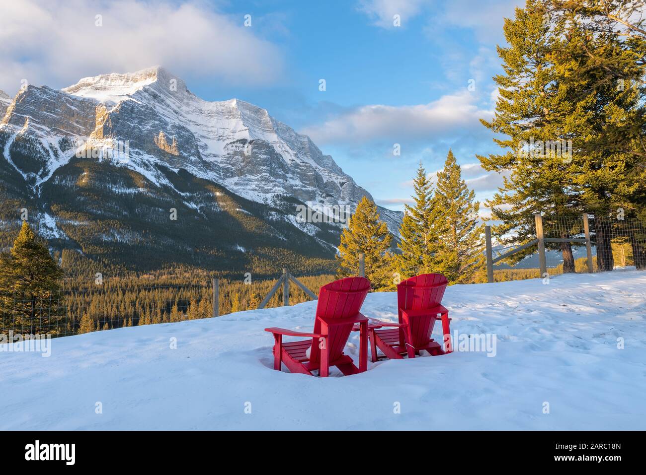 Red chairs next to the Legacy Trail and Mount Rundle in Banff National ...