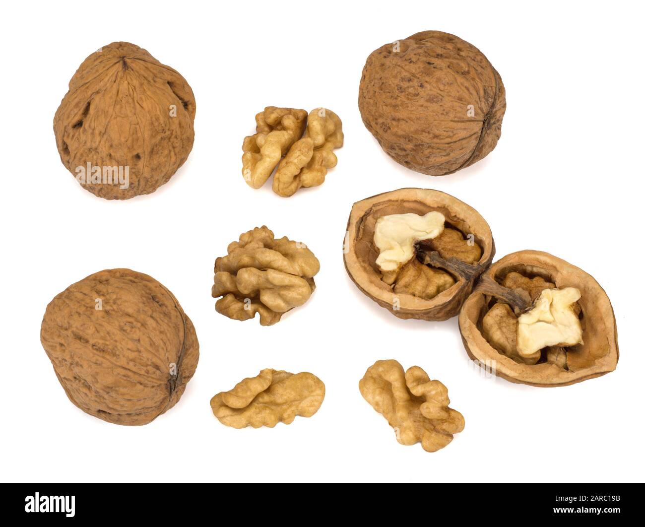 walnut and a cracked walnut isolated on white background Stock Photo ...