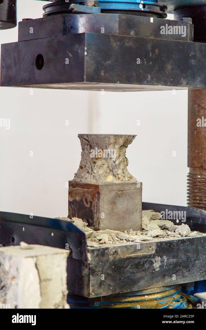 Construction laboratory. The press breaks down the cubic concrete ...