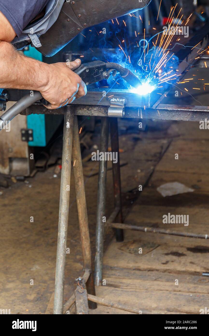 Man welding in a workshop Stock Photo - Alamy
