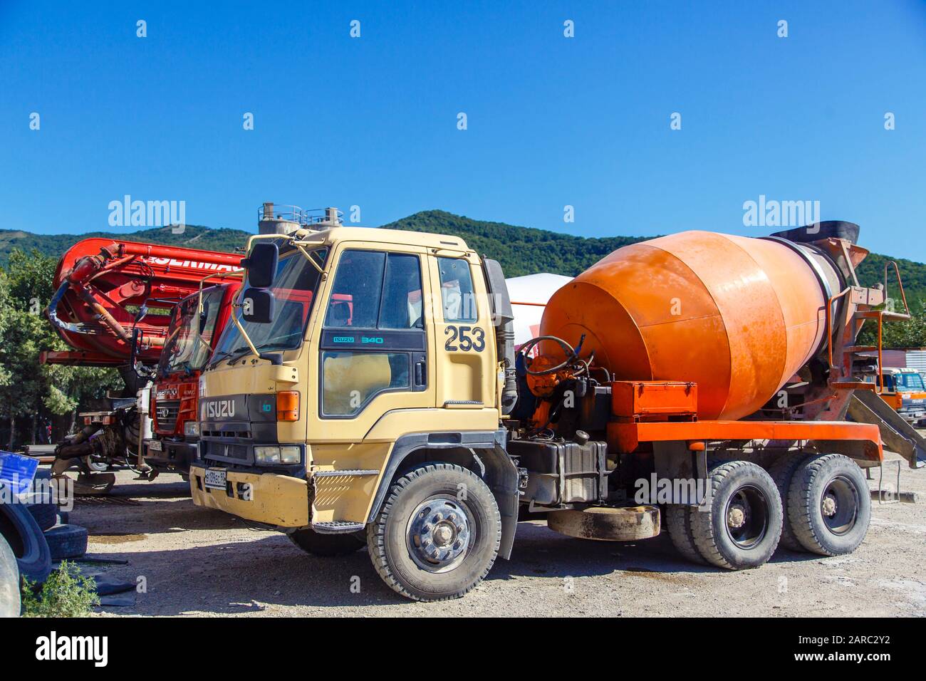 Concrete trucks on the construction site. Cars are not new, the dusty ...