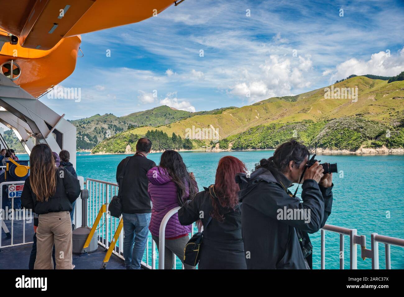 Passengers at MS Kaitaki, Interislander ferry, looking at Tory Channel ...