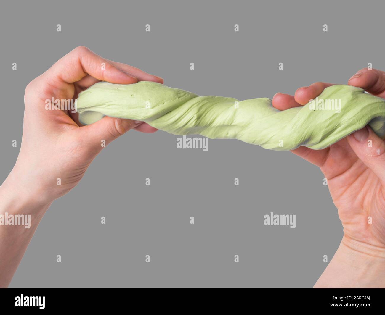 Sticky slime in the hand. The green slime in hands. Favorite toy for a ...