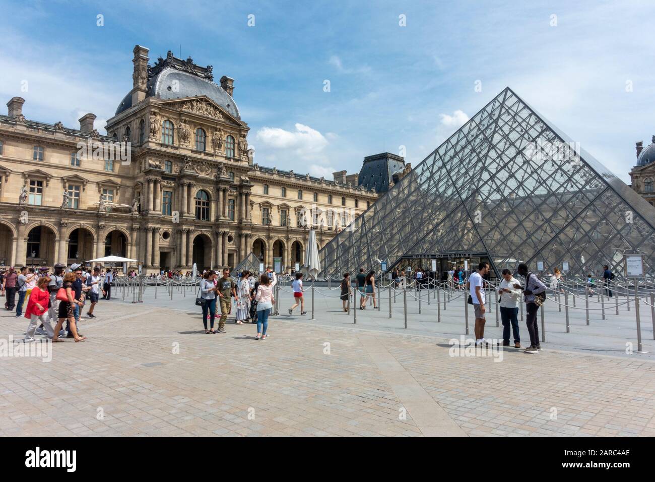 View of the Cour Napoléon (courtyard) and entrance Pyramid, with ...