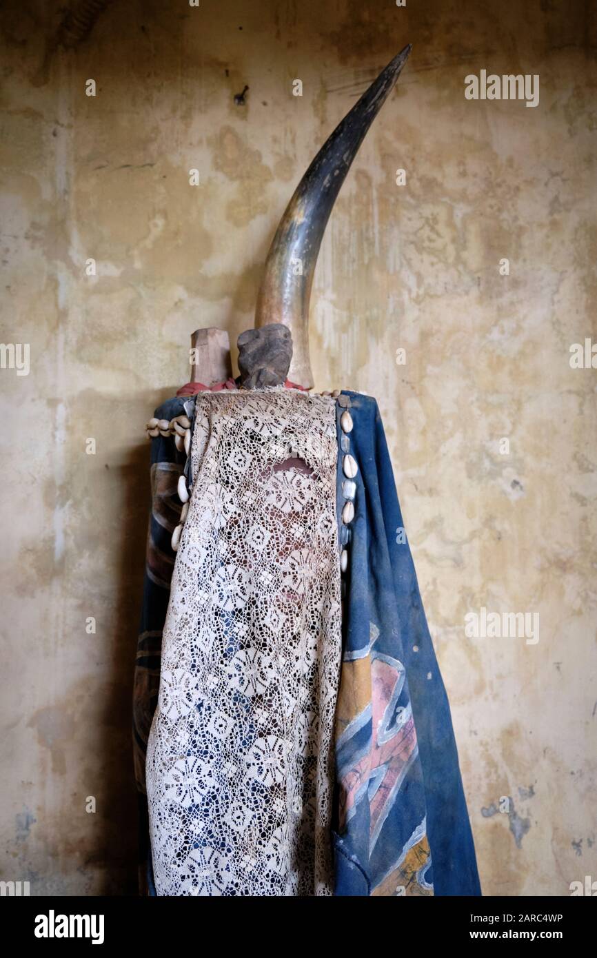 Boy in a traditional ceremonial costume of the Yoruba religion. The ...
