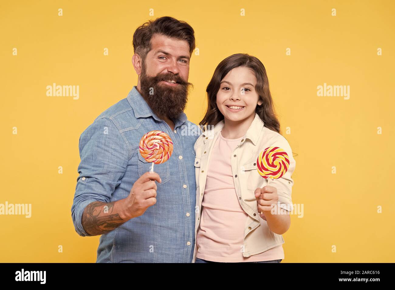 Sweet dessert. Bearded hipster good daddy for adorable daughter. Sweet ...