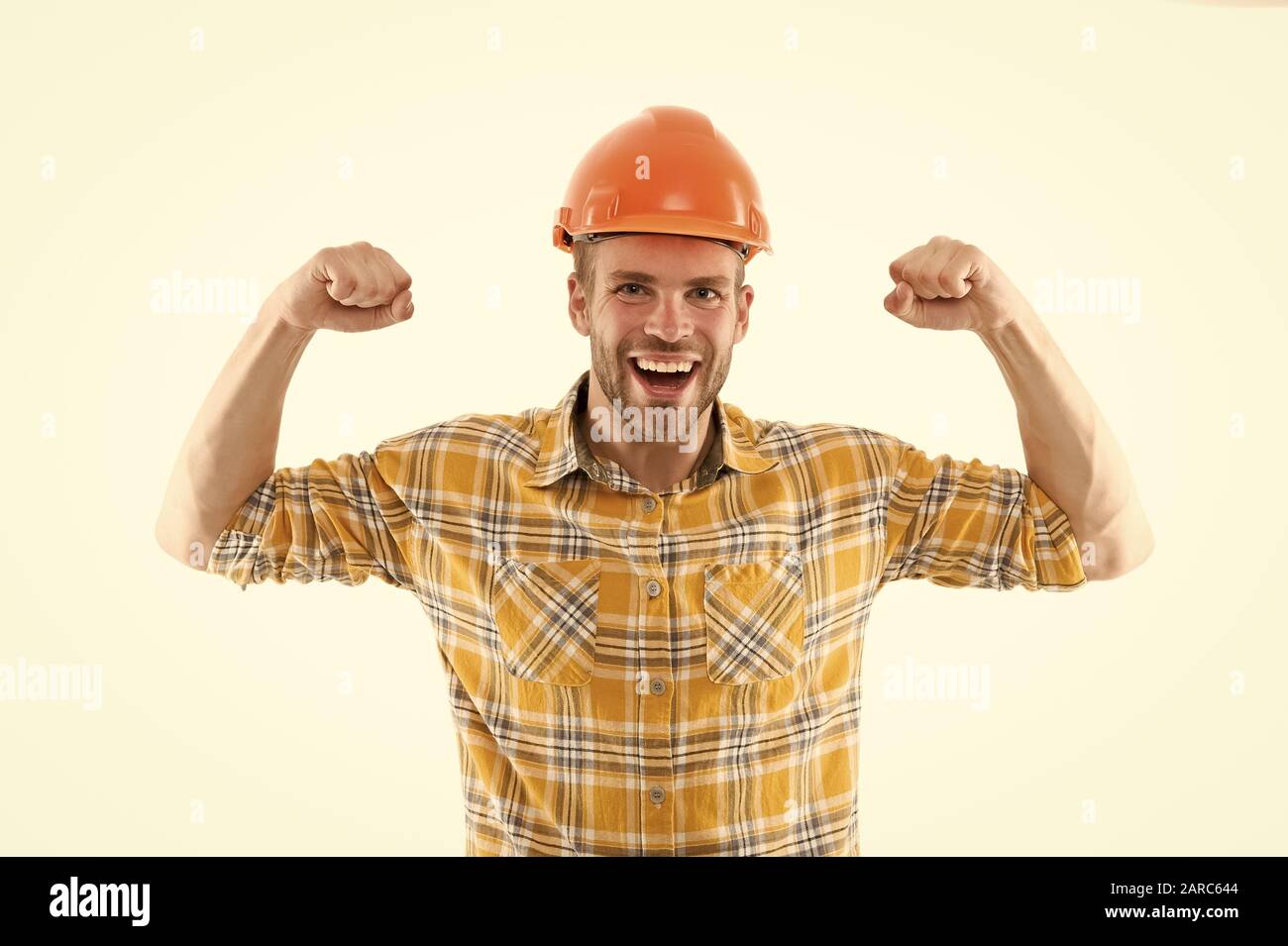 Successful engineer. Strong handsome builder. Man protective helmet and ...
