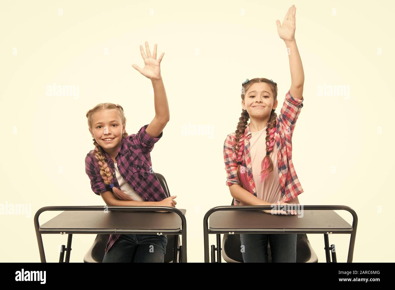Enjoy process of studying. Little girls school friends study together ...