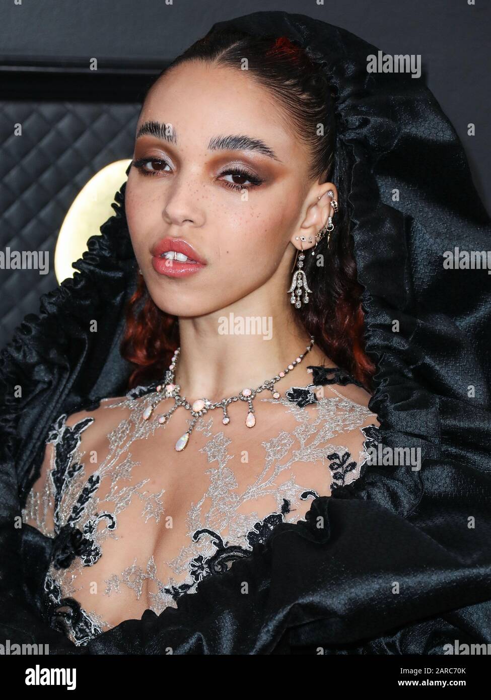 LOS ANGELES, CALIFORNIA, USA - JANUARY 26: Singer FKA twigs wearing a custom Ed Marler outfit ...